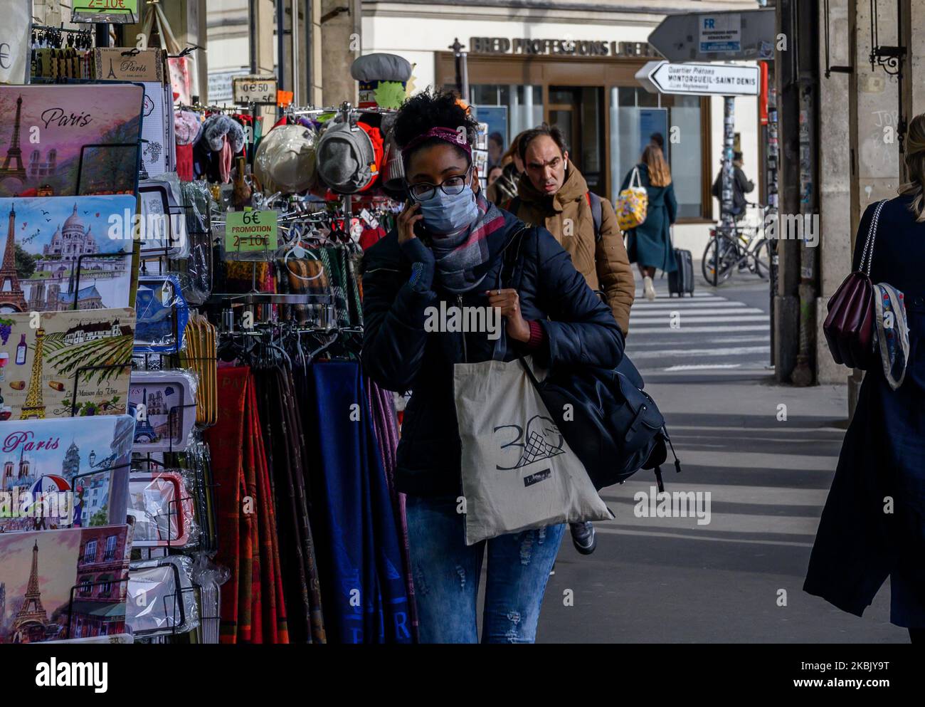 Woman wearing a protective mask on the streets of Paris, France on ...