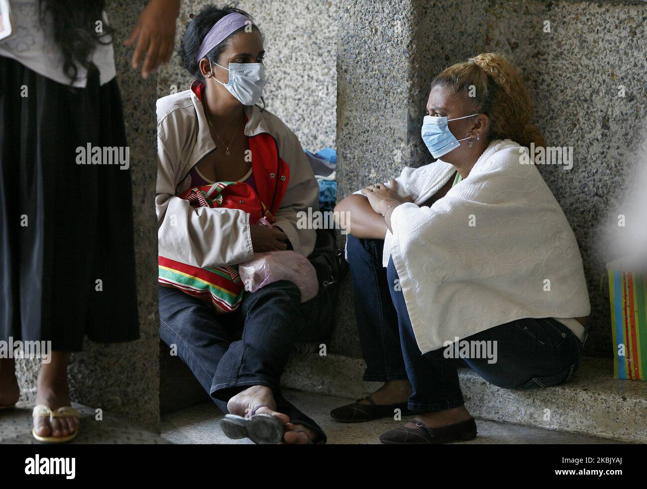 People wearing a protective mask in Caracas, Venezuela, on March 12 ...