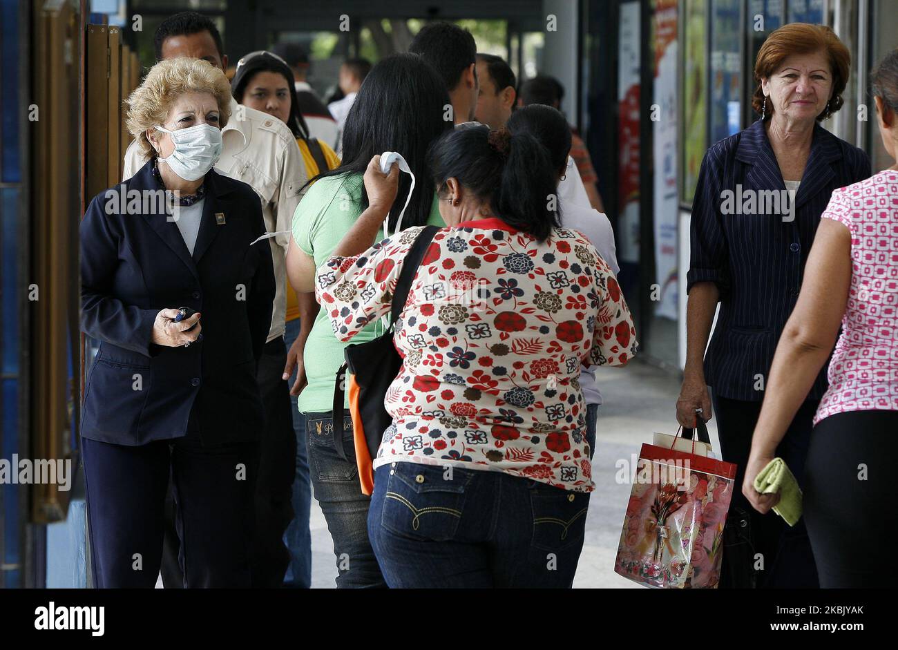 People wearing a protective mask in Caracas, Venezuela, on March 12 ...