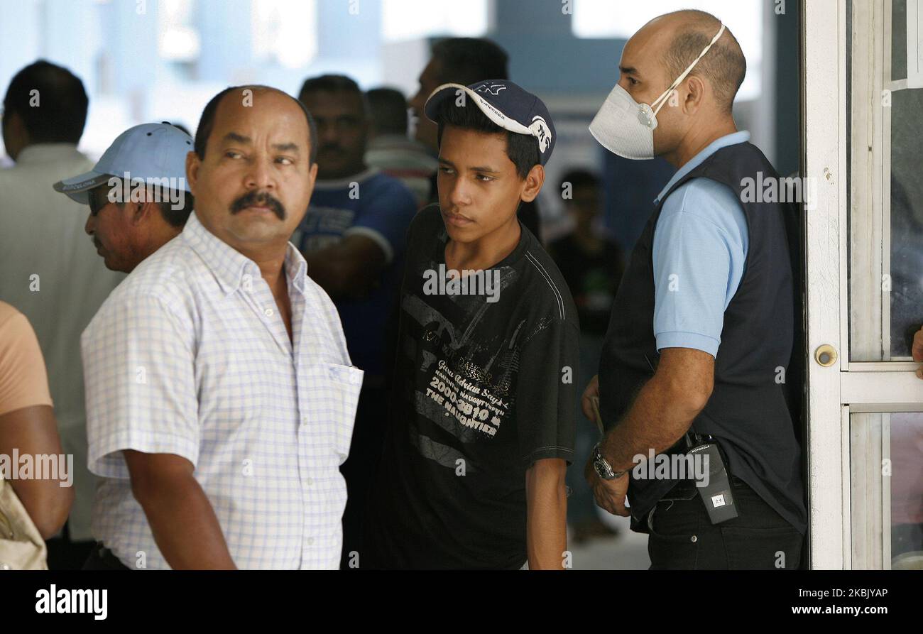 People wearing a protective mask in Caracas, Venezuela, on March 12 ...
