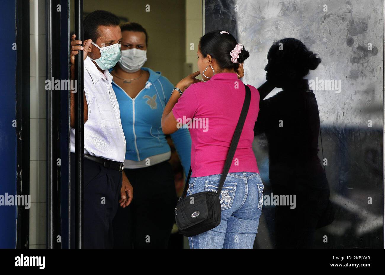 People wearing a protective mask in Caracas, Venezuela, on March 12 ...