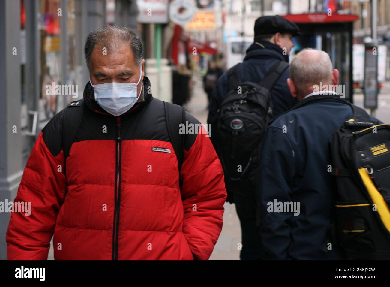 A man wears a face mask on a quieter-than-usual Shaftesbury Avenue in ...