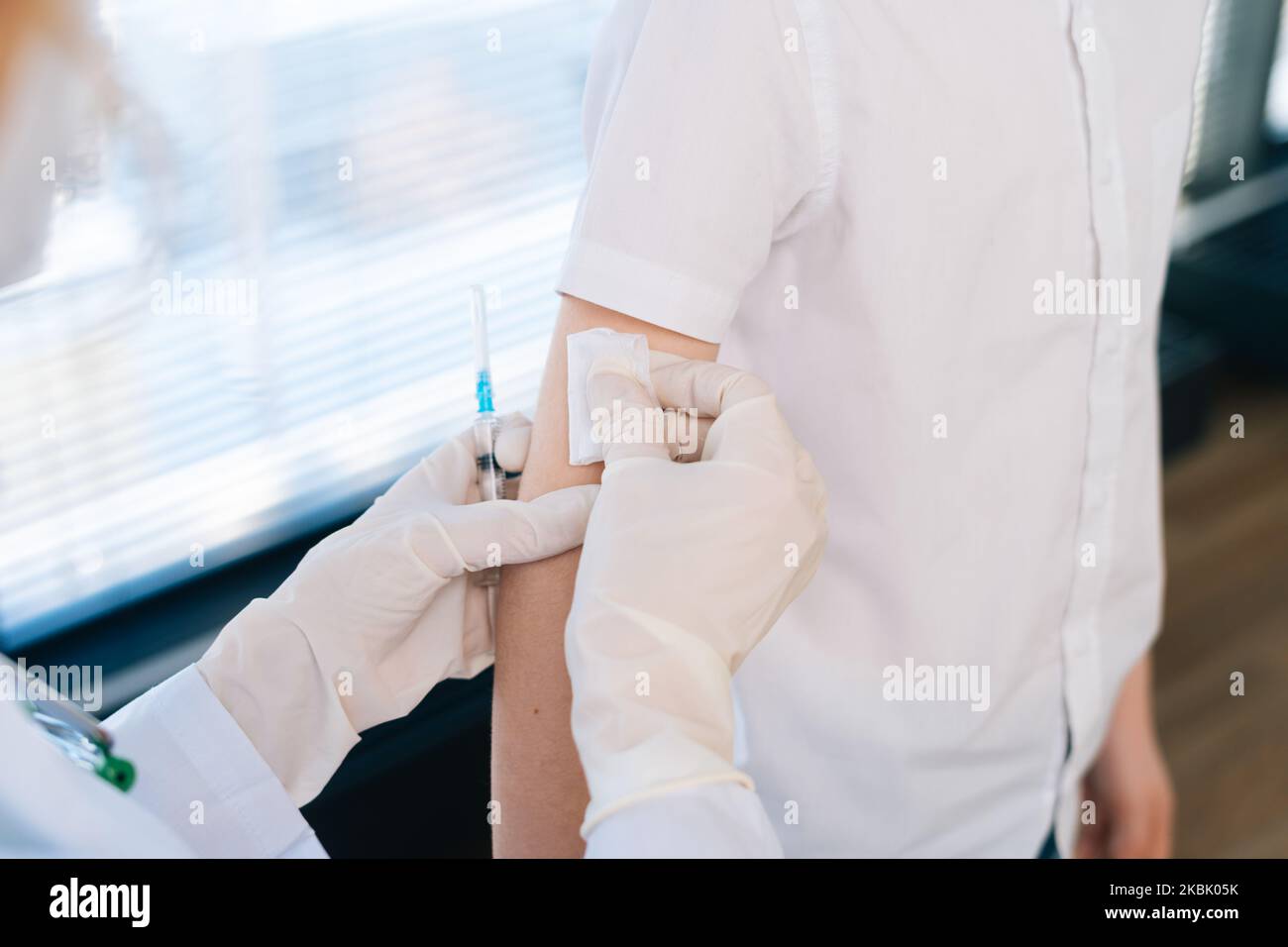 Close-up cropped shot of unrecognizable female doctor applying plaster ...