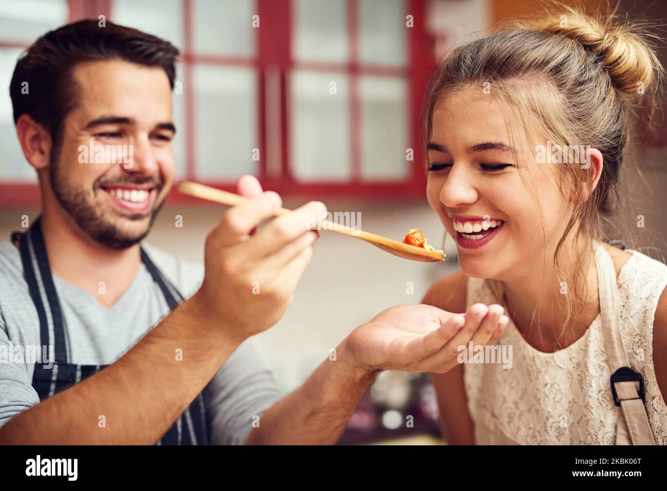 I love being his taster in the kitchen. a young man feeding his ...