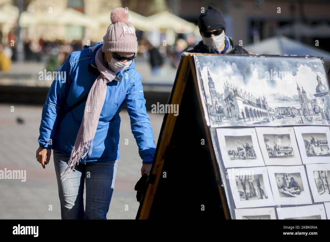 Foreign tourists are seen wearing protective face masks while visiting ...