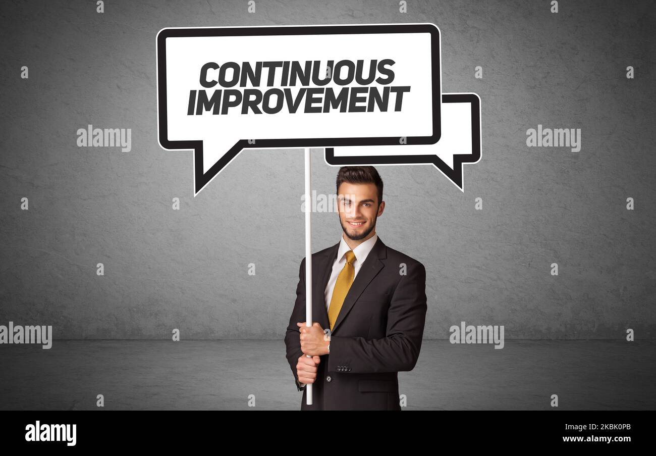 business person in casual holding road sign Stock Photo - Alamy