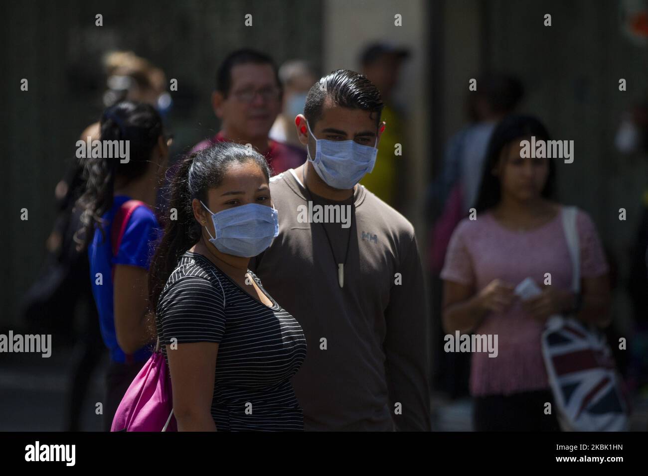 A couple prepares to use the Caracas metro wear face masks on March 14 ...