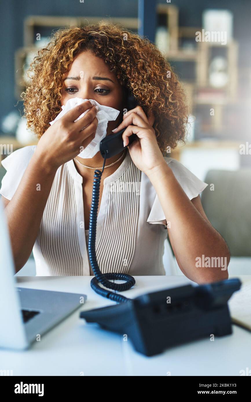 Hello can you help me. a frustrated businesswoman blowing her nose and ... Hello can you help me. a frustrated businesswoman blowing her nose and ...