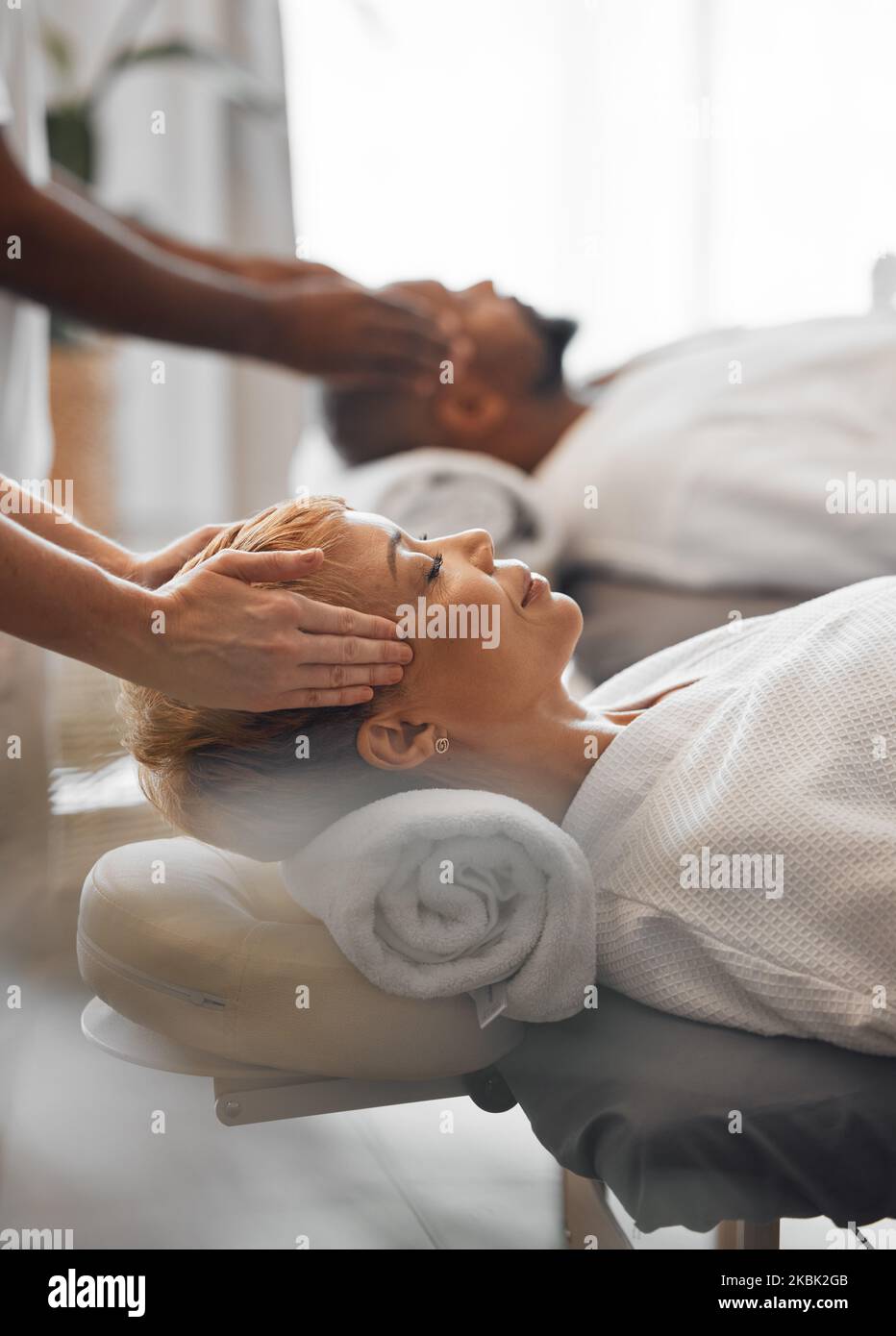 Hands, head and massage with a woman customer in a spa to relax for ...