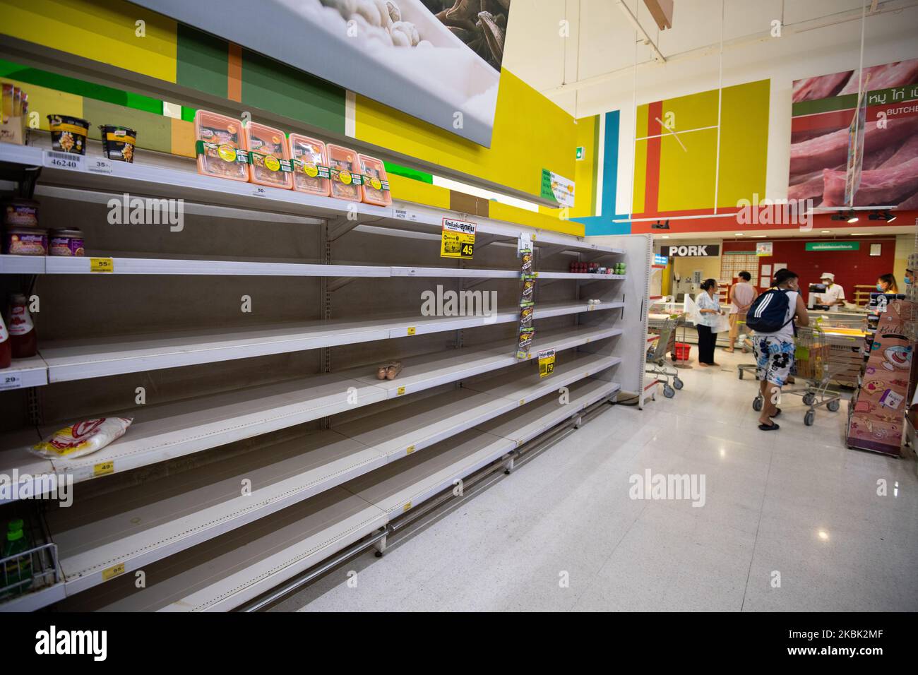 An almost empty shelf is in a supermarket in Bangkok, Thailand on March ...
