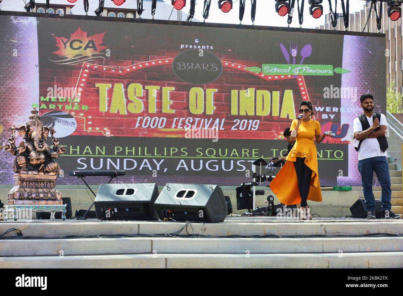 Indian singers perform a Bollywood film song during the Taste of India ...