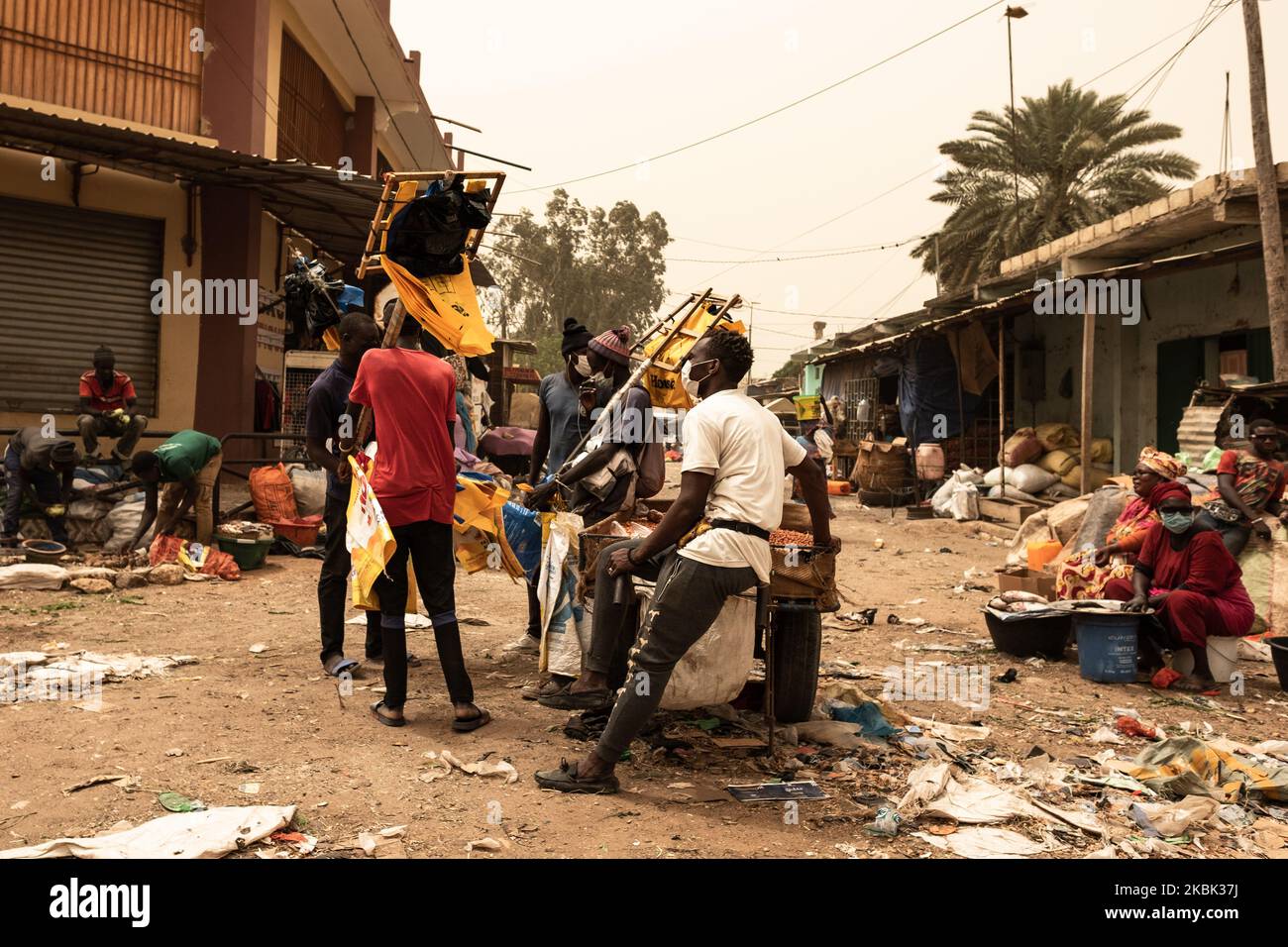 People at a market in Mbour during a dust sand storm in Dakar, Senegal ...