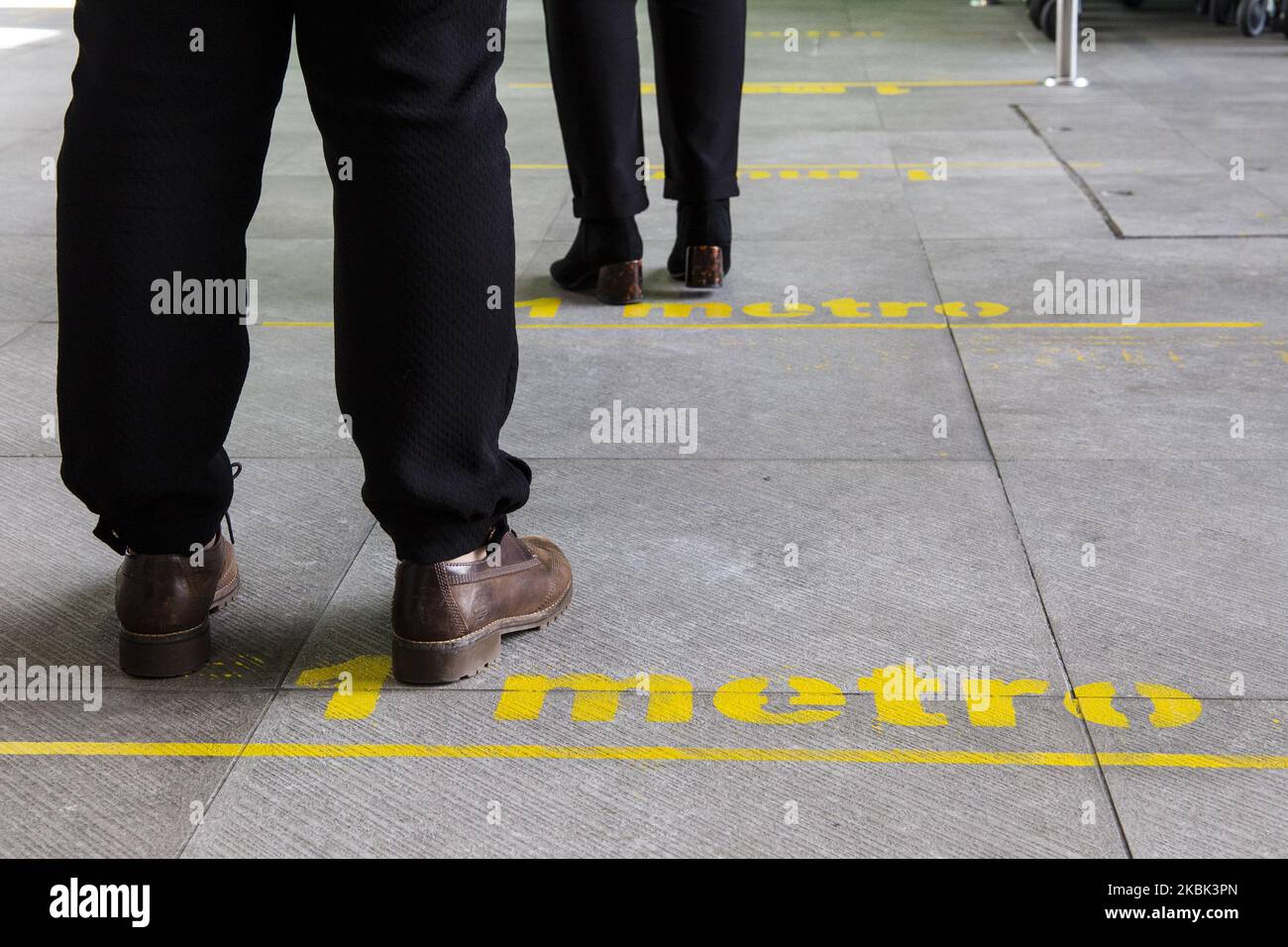 supermarket with indications of 1 meter distance, safety distance, due ...