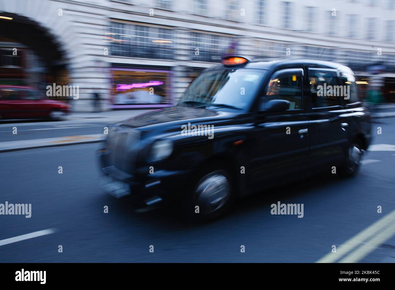 A taxi drives along Regent Street in London, England, on March 16, 2020 ...