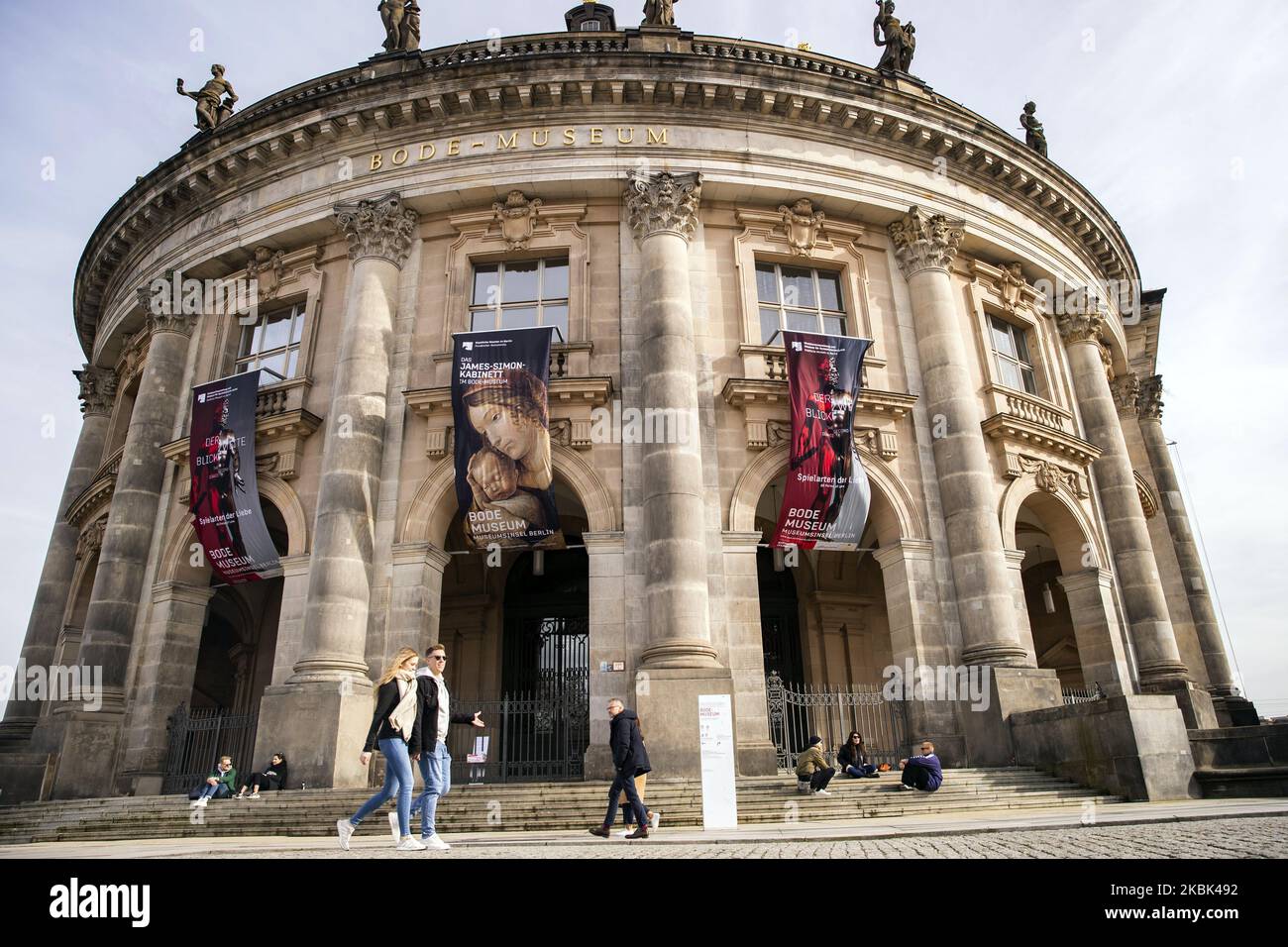People walk past the closed building of the Bode Museum in Berlin ...