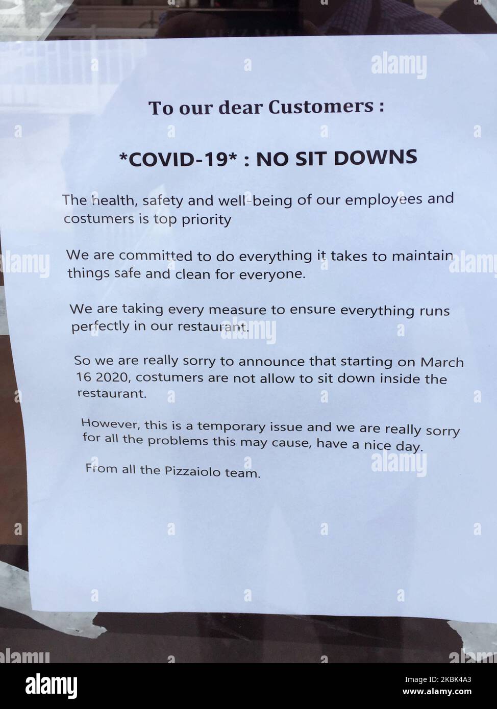 Sign in a restaurant window telling patrons they can no longer dine-in ...