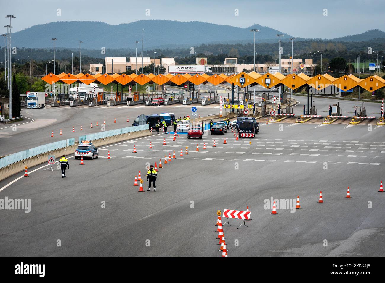 Spanish police forces at the checkpoint control entry and exit at the ...