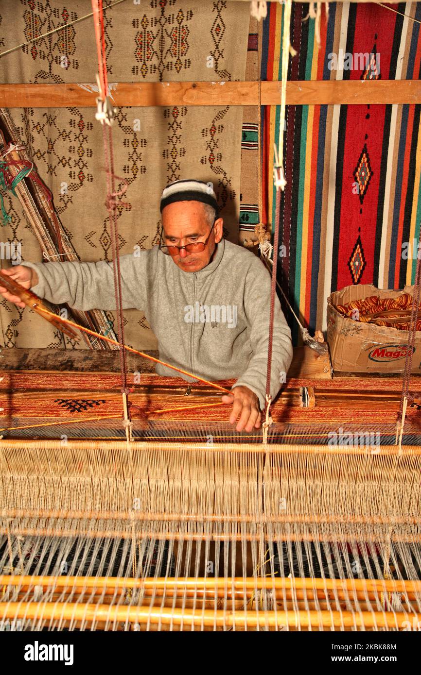 Man weaving a carpet on a loom using Agave silk in Chefchaouen, Morocco ...