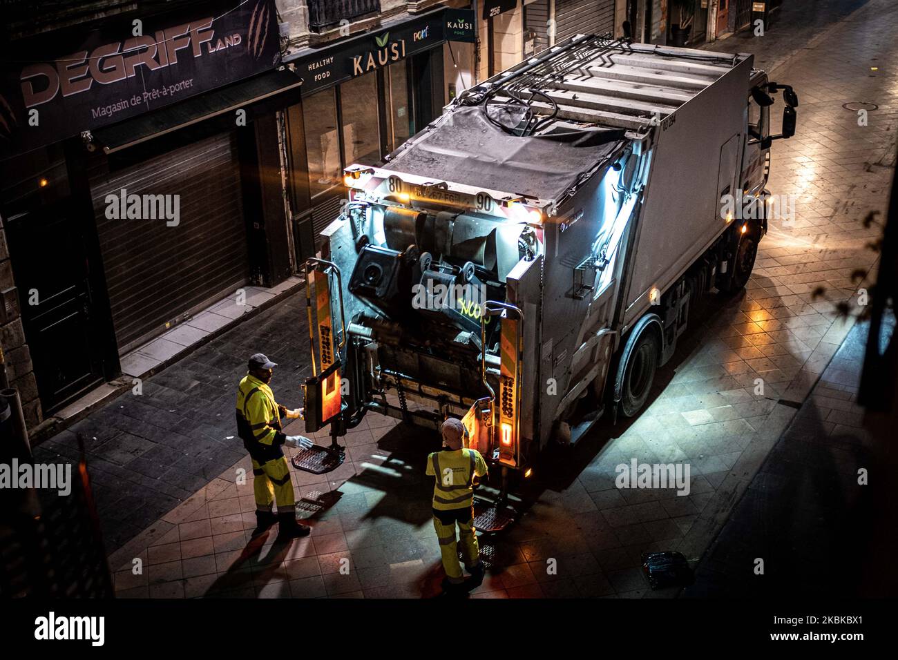 People pick up garbage without real protection, in Bordeaux, on March ...