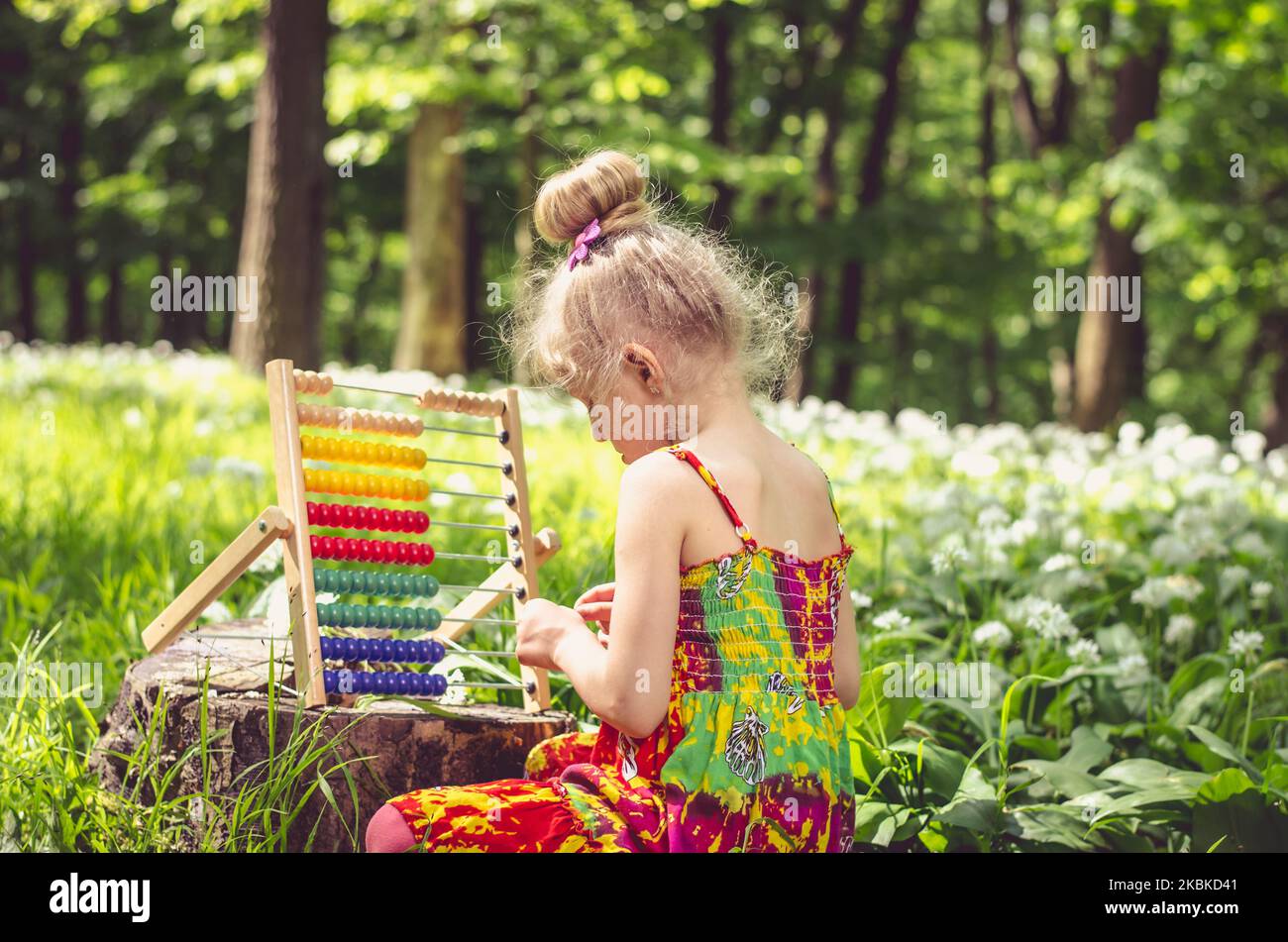 preschool kid learning counting with the abacus Stock Photo - Alamy