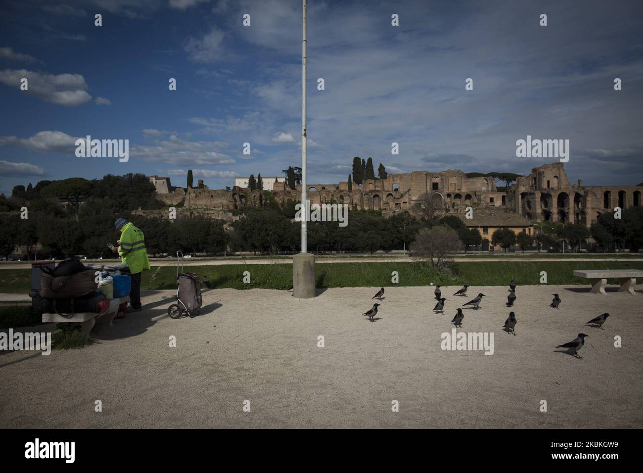 An homeless person feeds the crows in a deserted Circus Maximus, Rome's ...