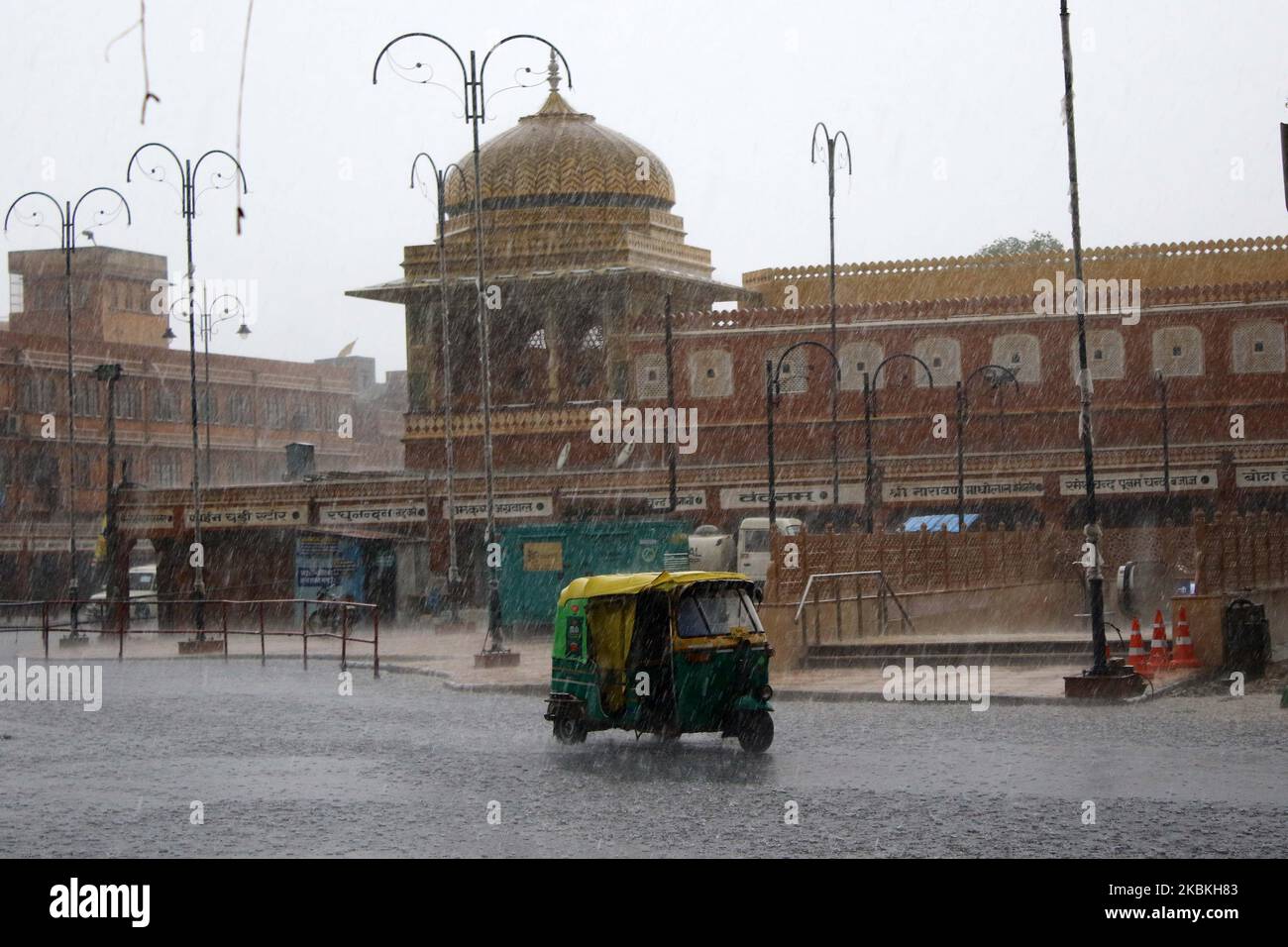 Auto rickshaw passes while raining at Badi Chopad area during the ...