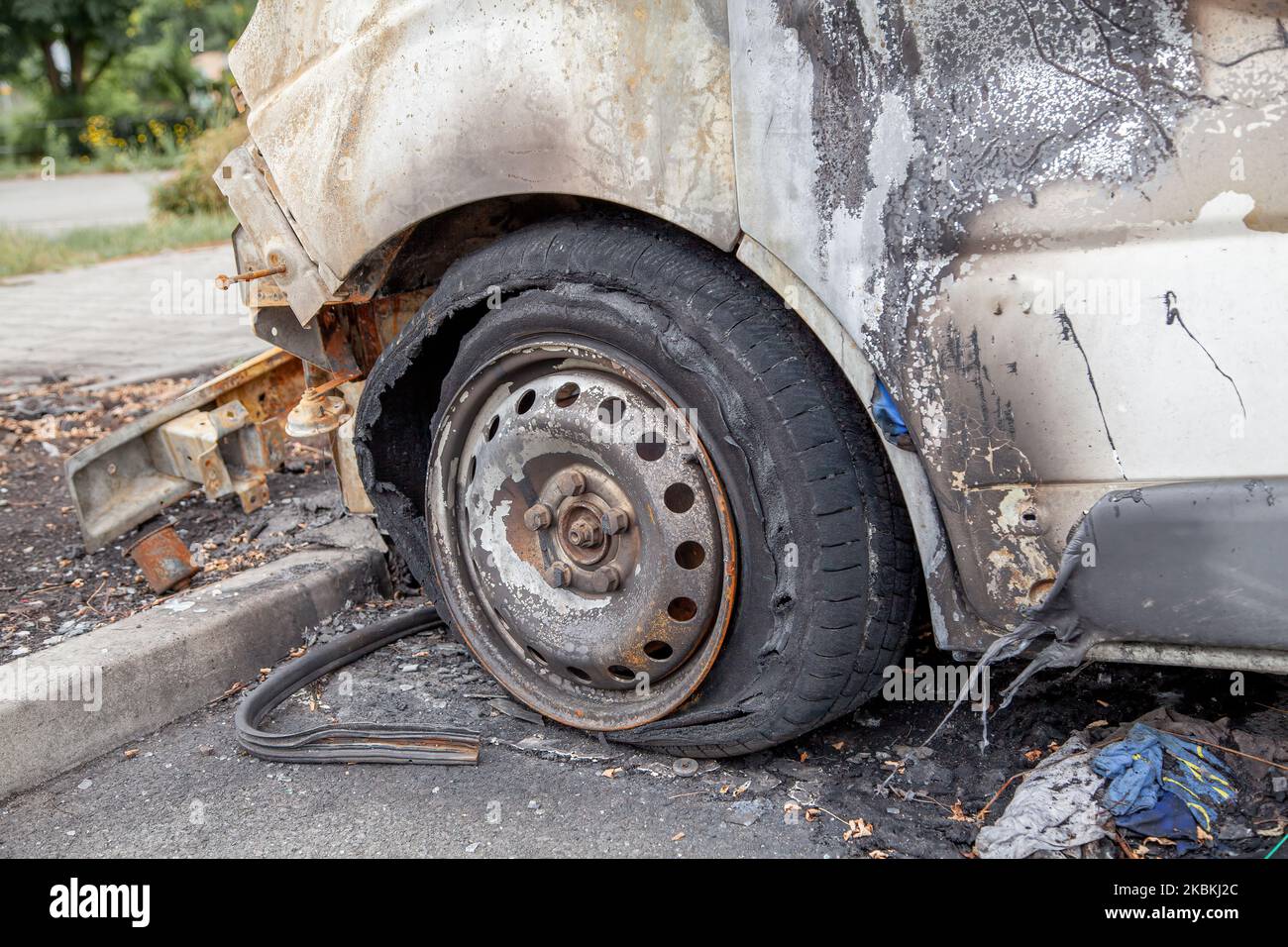 Minibus after a fire, burnt body and interior of the car. Burnt rusty ...