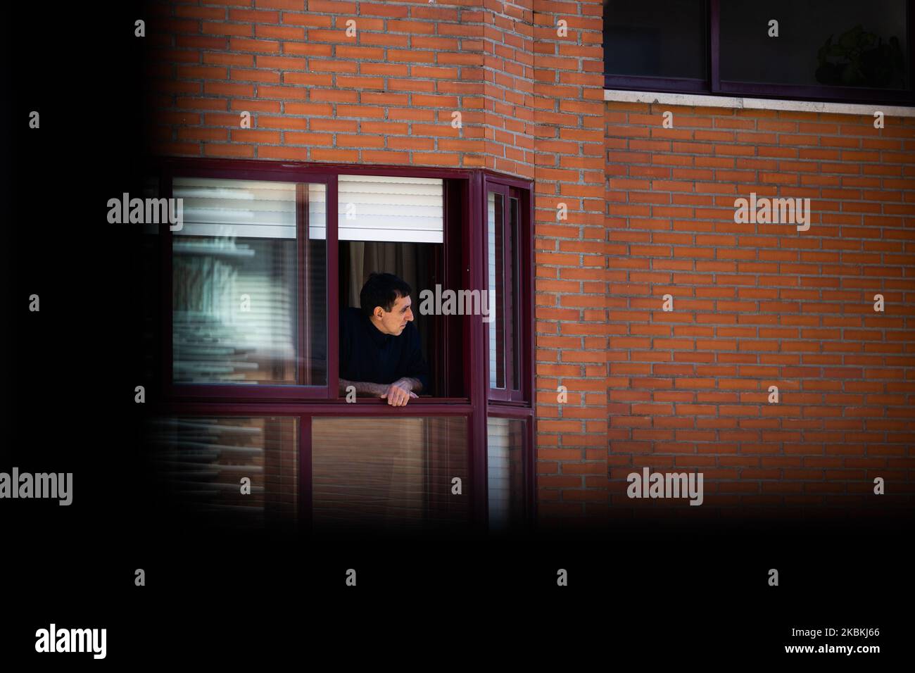 A man looks on his balcony on Alcorcón neighbor, Madrid during the ...