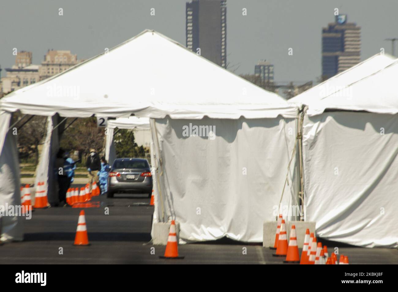Cars line up for COVID-19 testing at a drive-through test site set up ...