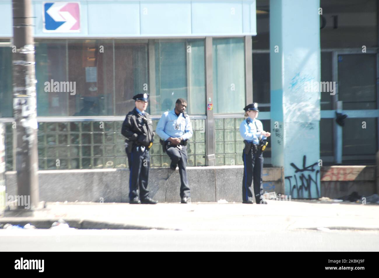 Philadelphia Police Officers watch over the few commuters making their ...