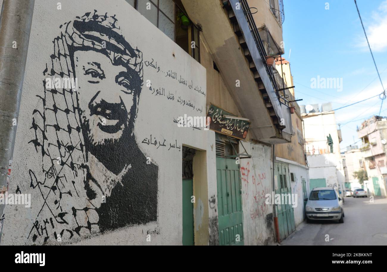 An image of Yasser Arafat on a mural painting in Bethlehem. On Thursday ...