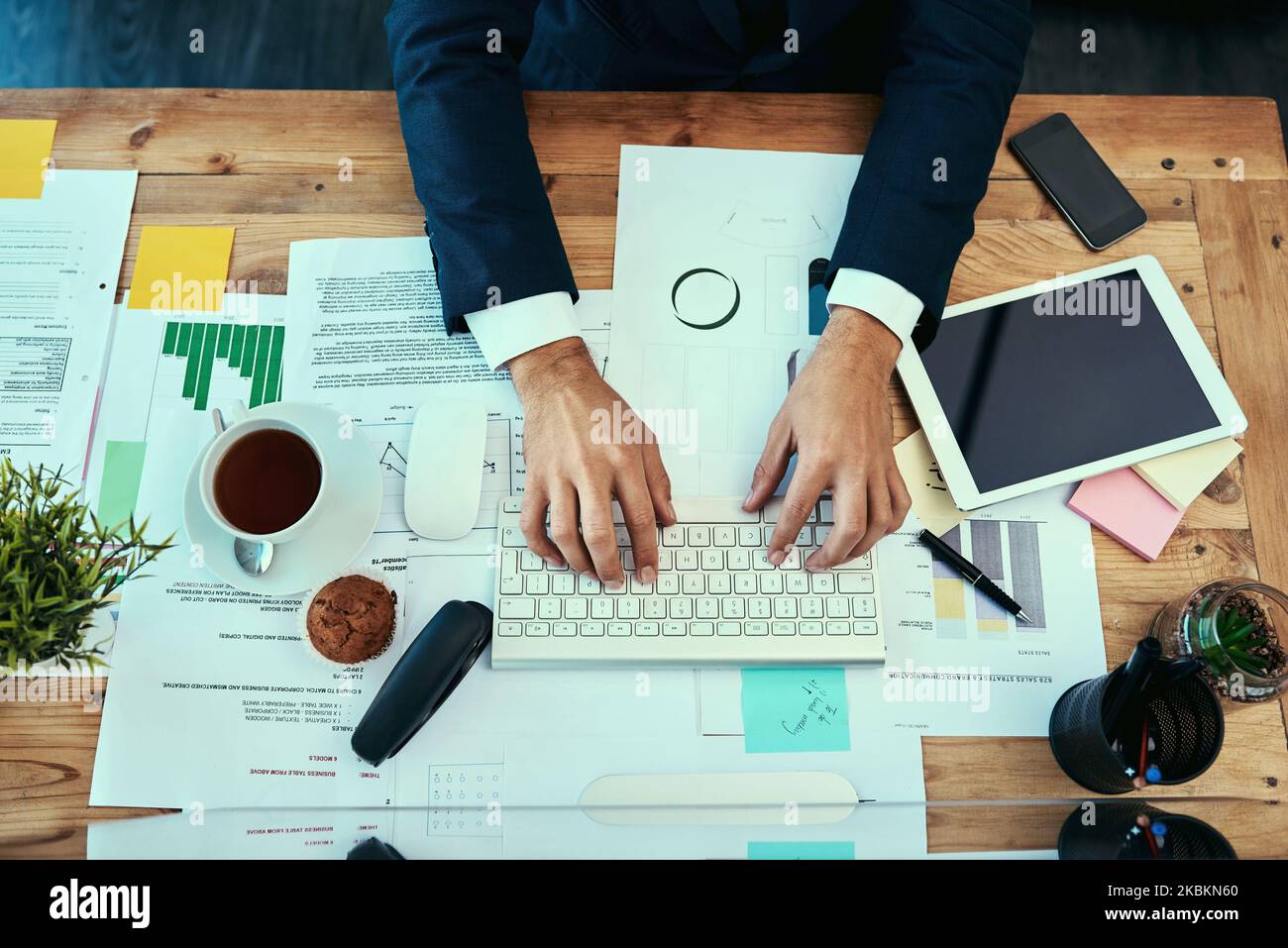 Busy business days. High angle shot of an unidentifiable businessman ...