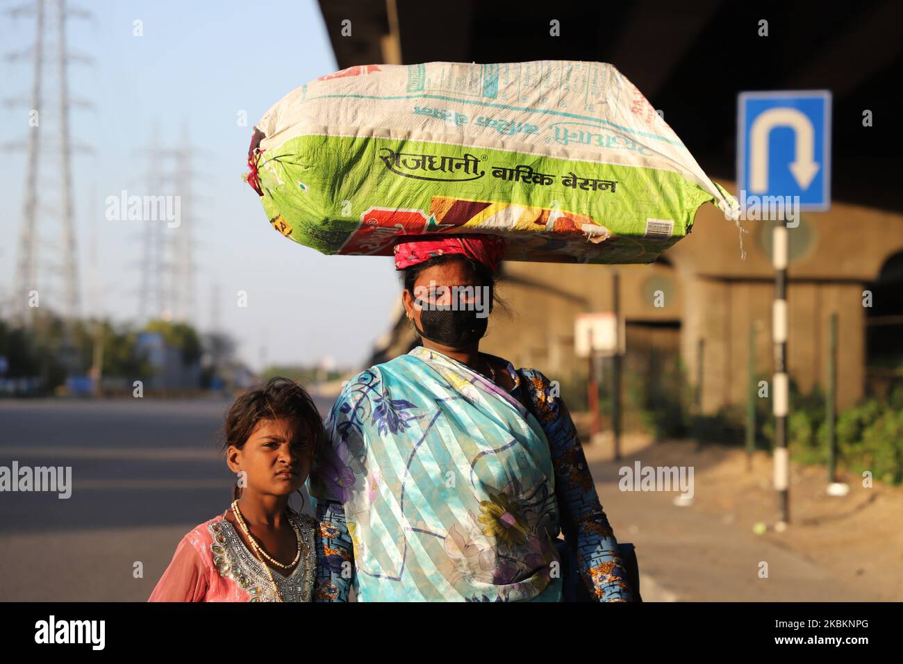 Covid india migrant workers walk hi-res stock photography and images - Alamy