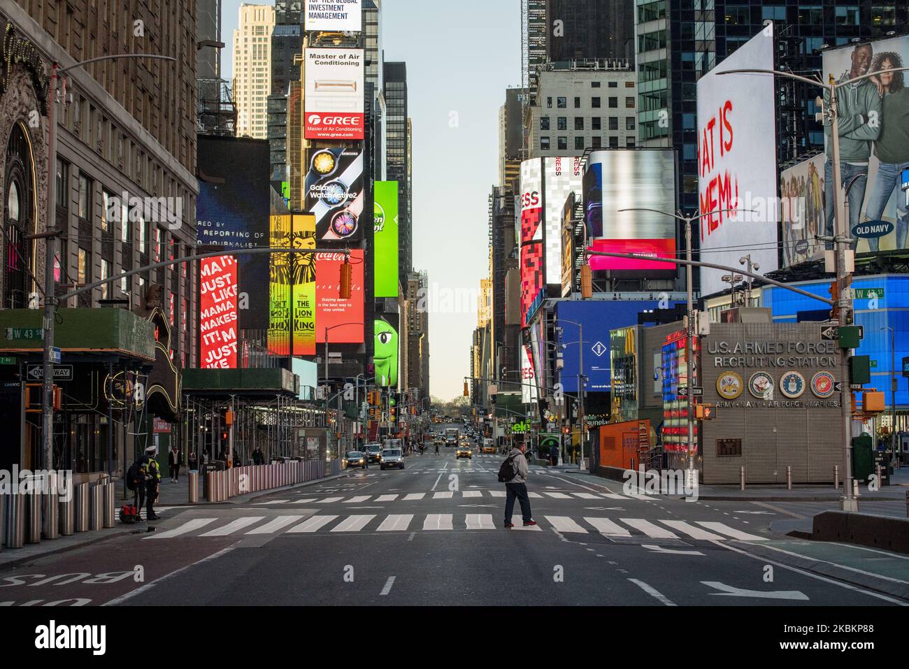 Pedestrians walk through en empty Times Square on Friday, March 2020 in ...
