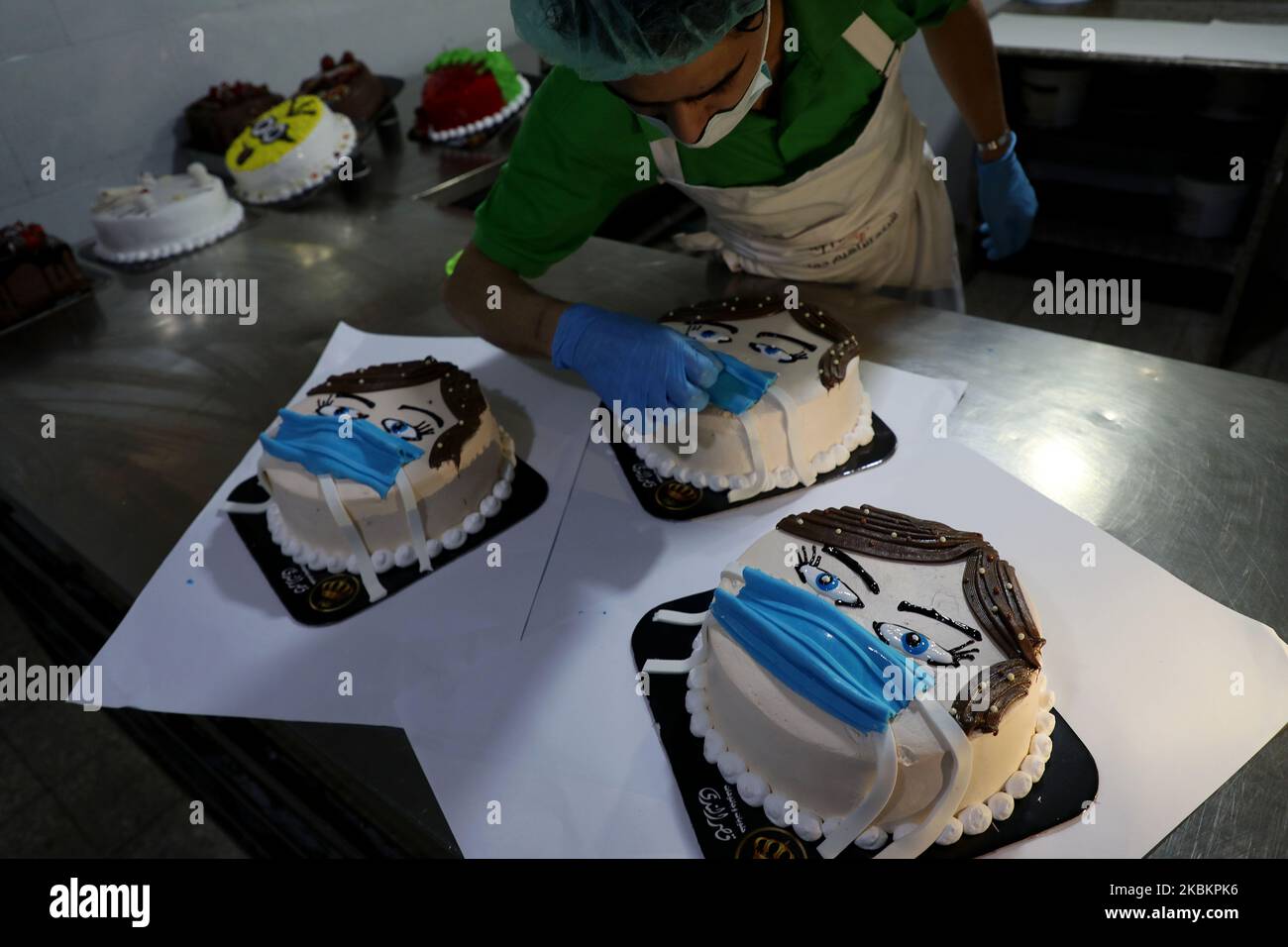 A Palestinian produces cakes that look like emojis with protective ...
