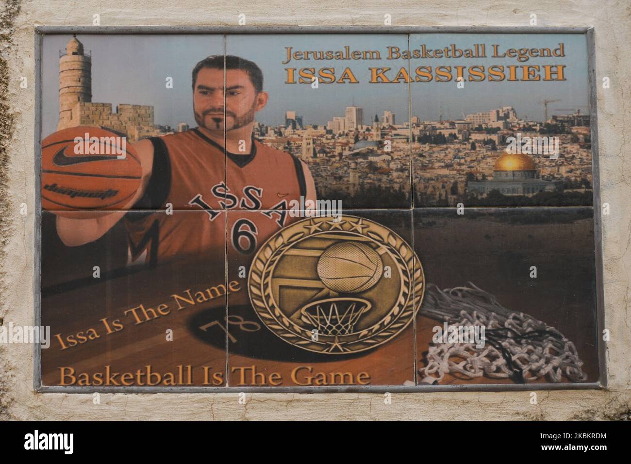 A sign with an image of Issa Kassissieh, a Palestinian Orthodox ...