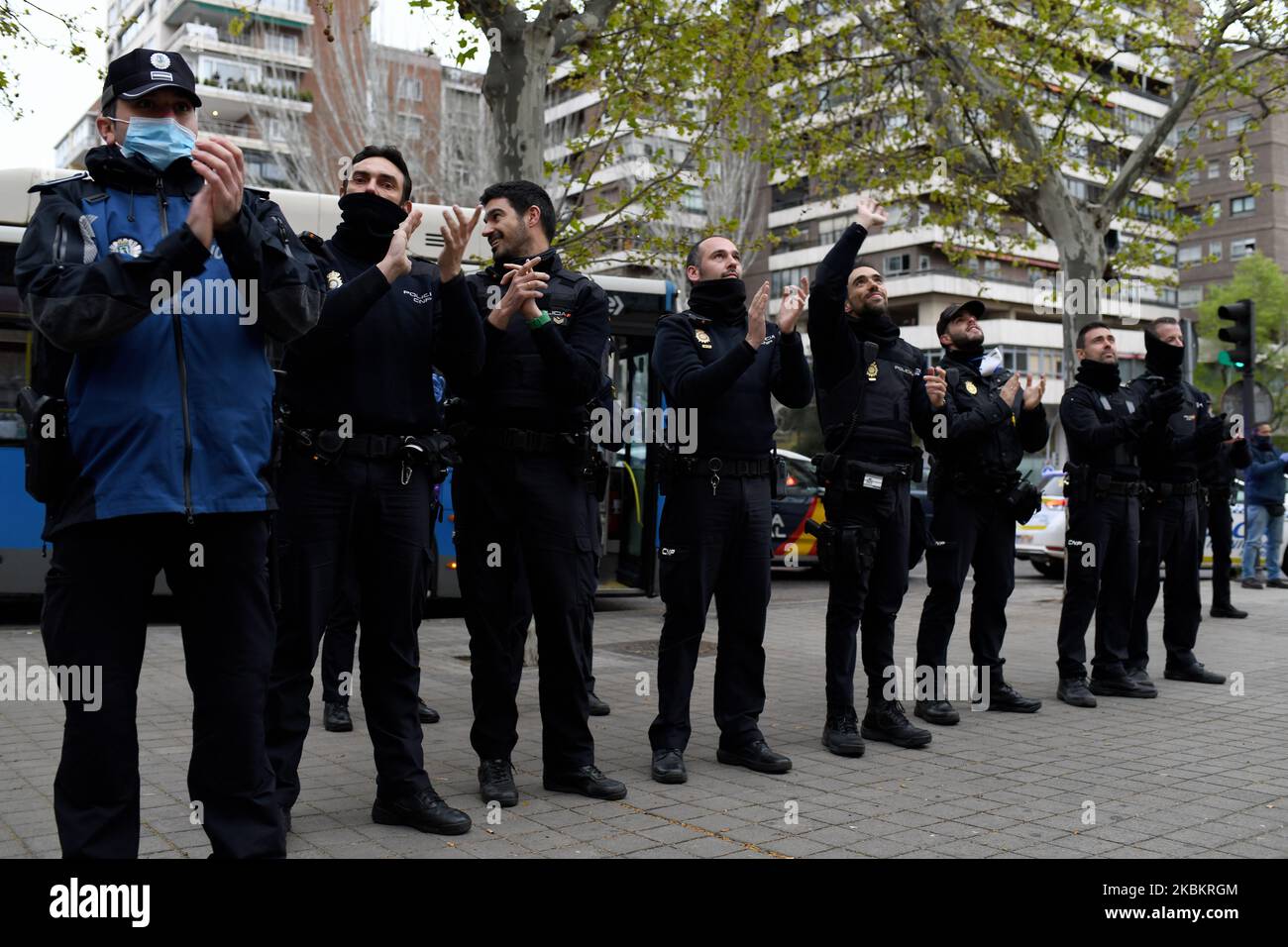 National Police officers claps his hands, along with his colleagues to ...
