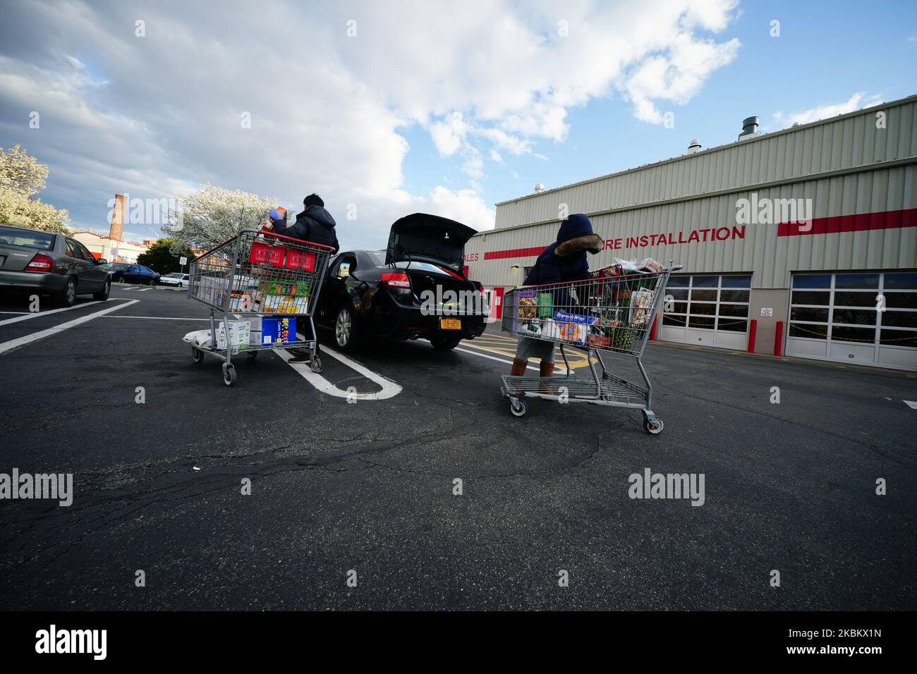 A view of shoppers in the parking lot of Costco in Queens, New York ...