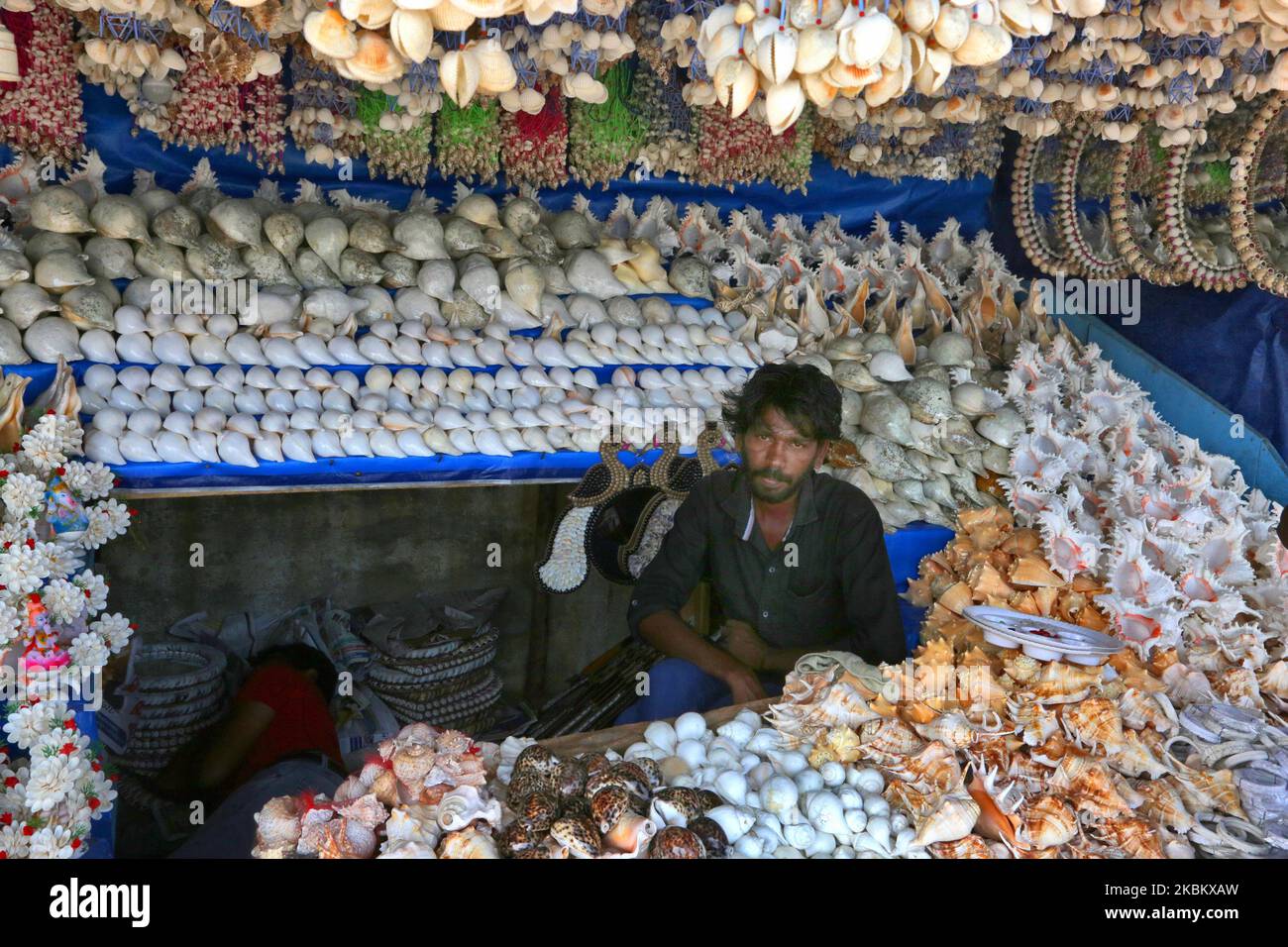 Man selling seashells and seashell handicrafts in Kanyakumari, Tamil ...