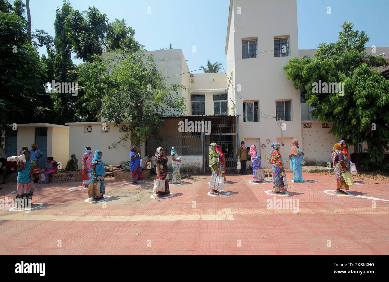 Below poverty line people stands in the queue as they are maintaing the ...