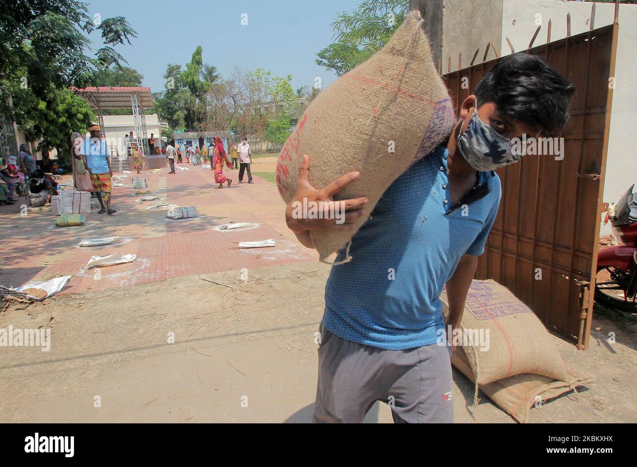 Below poverty line people stands in the queue as they are maintaing the ...