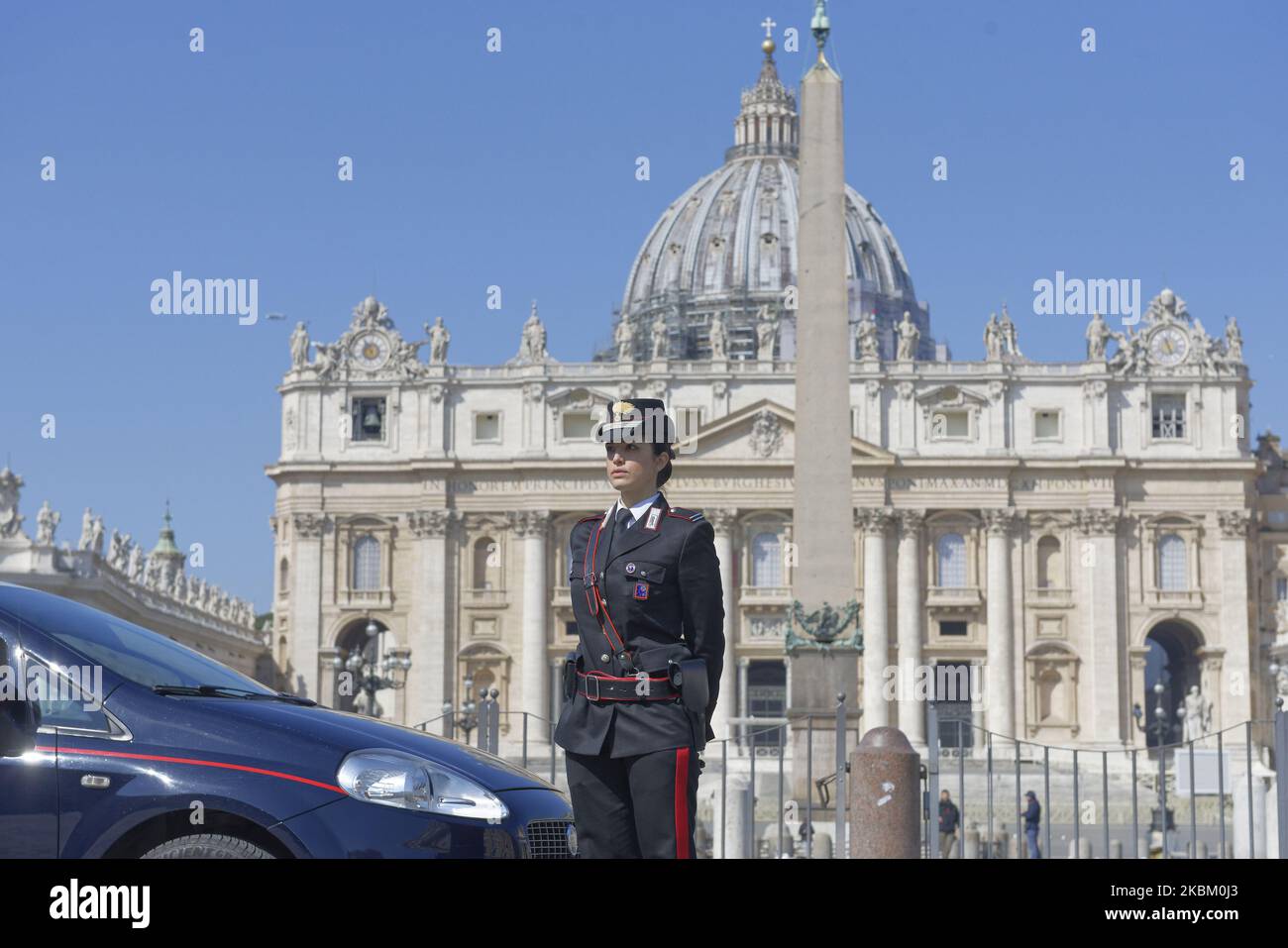 Italian police cars patrol the area outside an empty St.Peter's Square ...