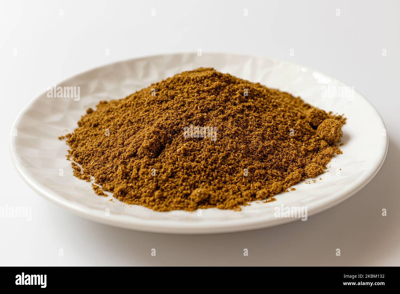 Garam masala on a white background Stock Photo - Alamy