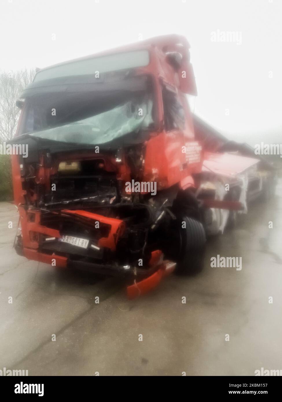 The remains of 22 heavy trucks that were part of a chain crash ...