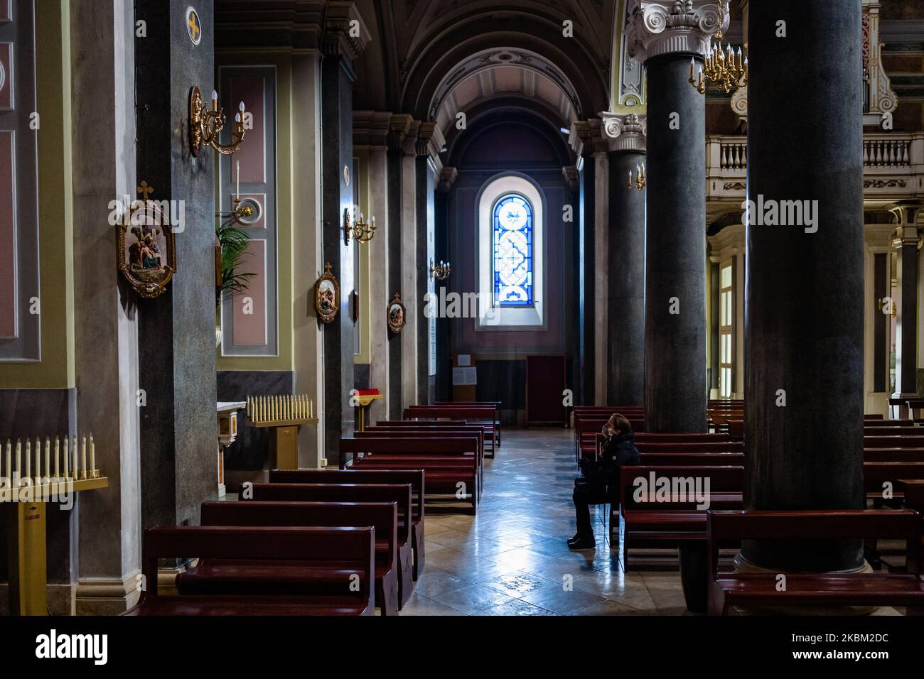 A faithful prays in the Immaculate Church in Molfetta during the ...