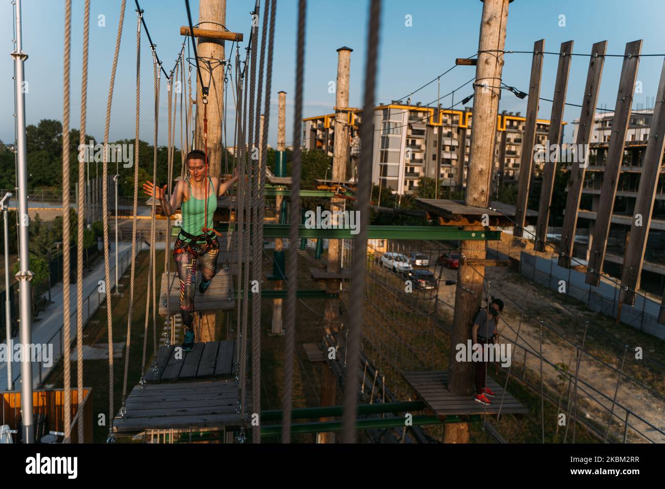 Adult woman trying and struggling to finish the courses with the sunset ...