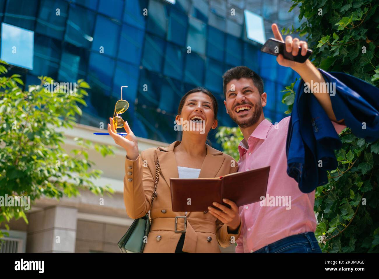 Smiling rich man pointing hi-res stock photography and images - Alamy