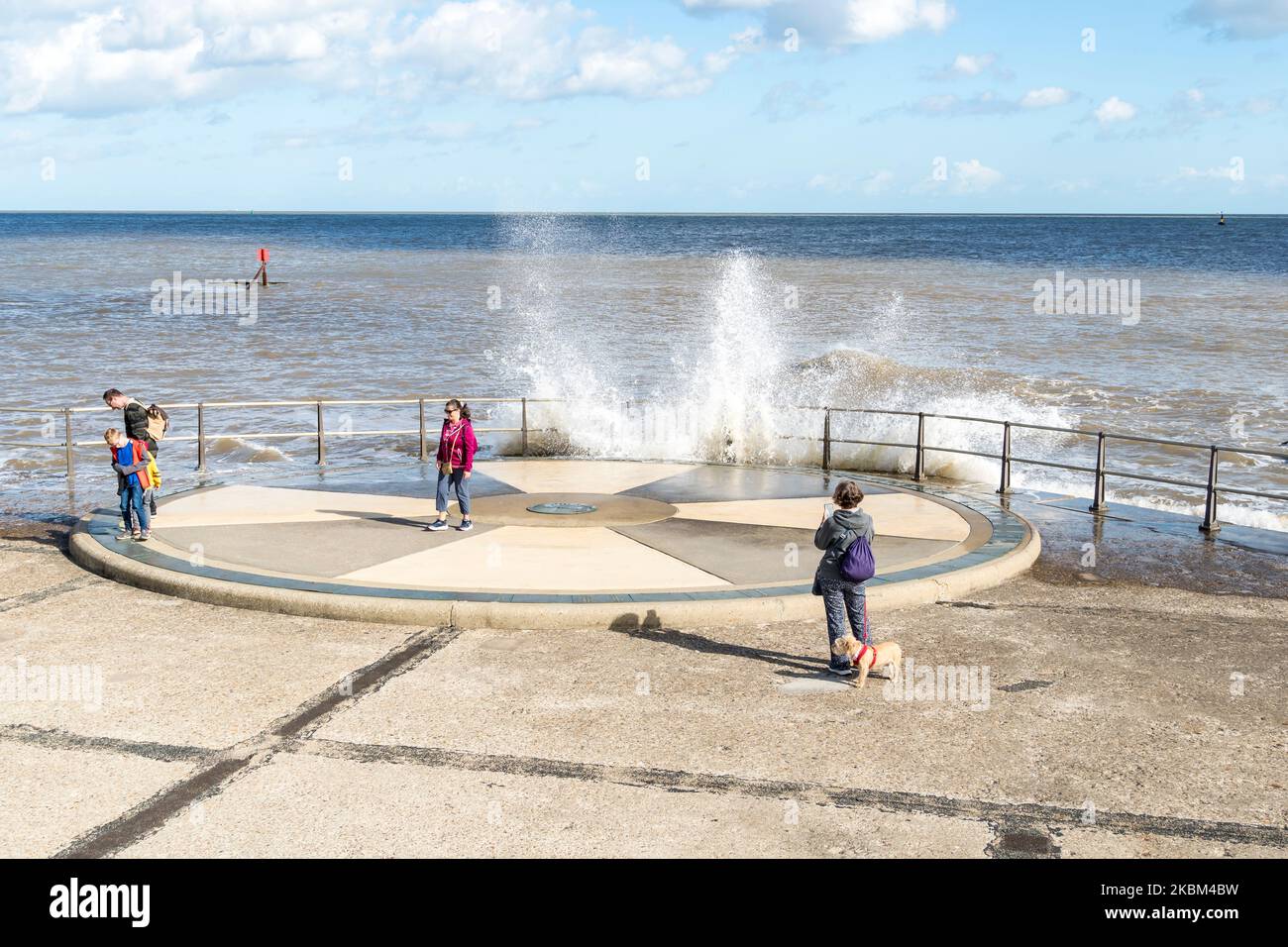 Waves breaking against sea wall at Ness point Englands most easterly ...