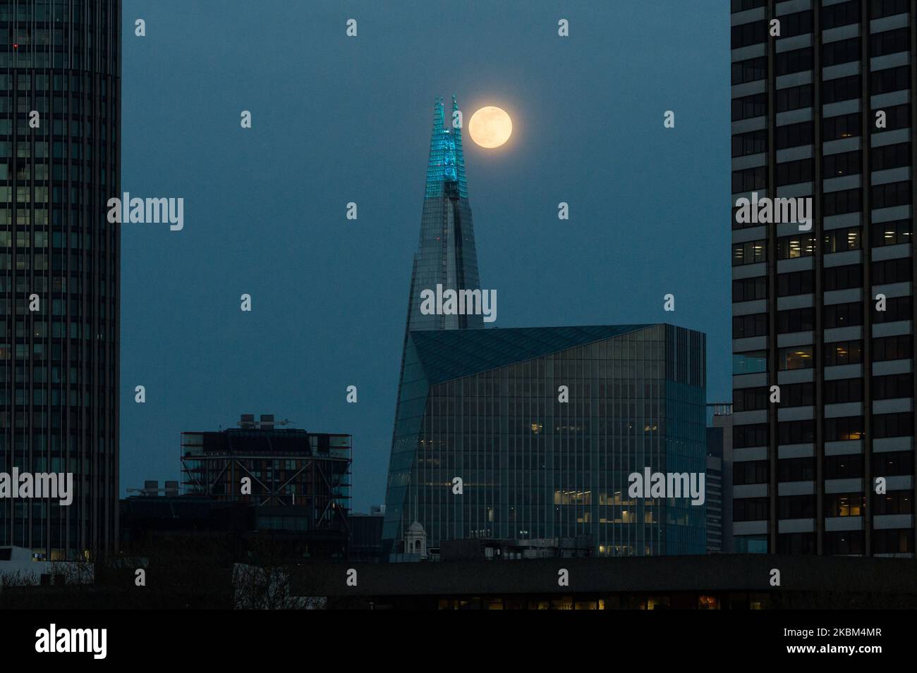 A super moon, also called full pink moon, rises above central London on ...
