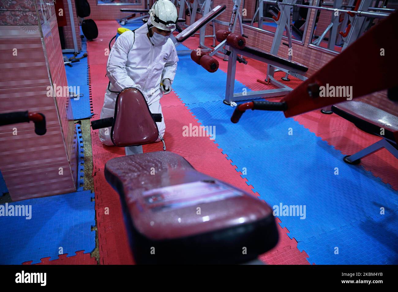 Member of white helmets sterilizes a bodybuilding gym in Idlib province ...